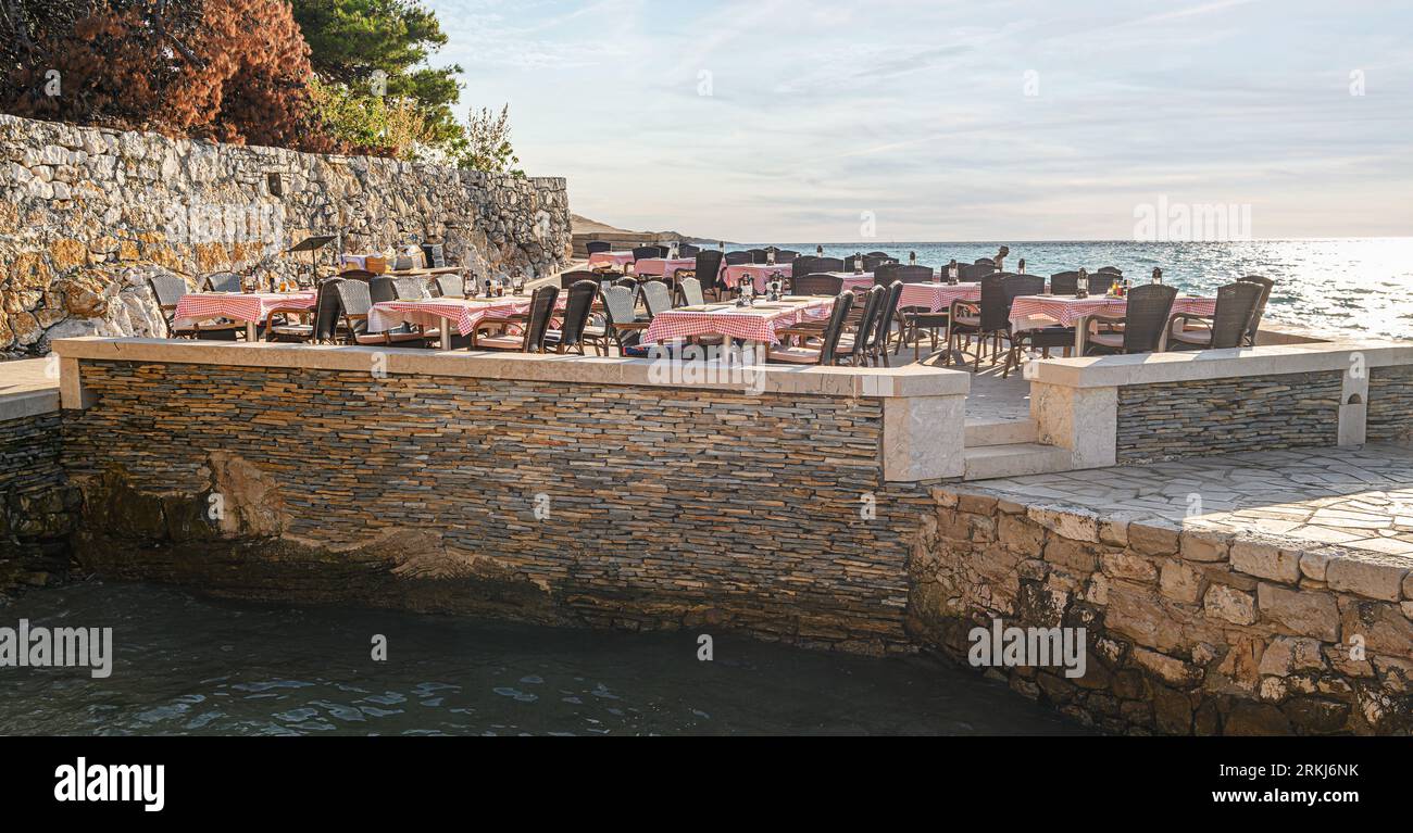 The interior of an open-air restaurant on the seashore Stock Photo - Alamy