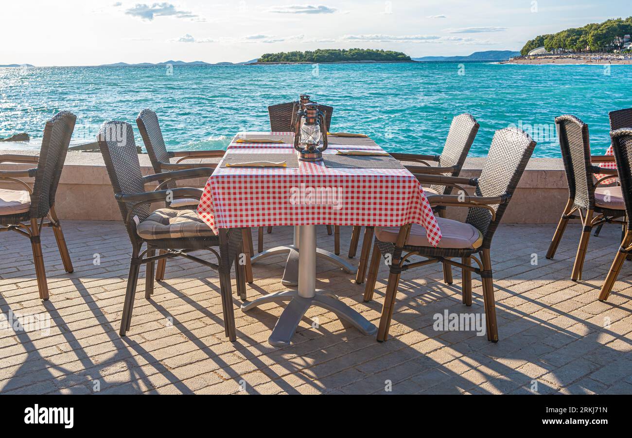 The interior of an open-air restaurant on the seashore Stock Photo - Alamy