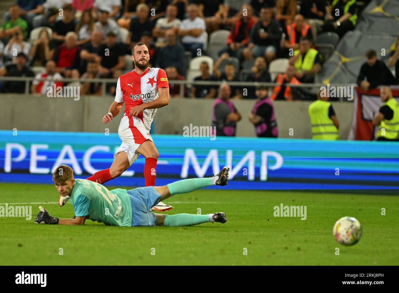 L-R Vaclav Jurecka (Slavia) scores against goalkeeper Yakiv Kinareykin (Dnipro) in the UEFA ...