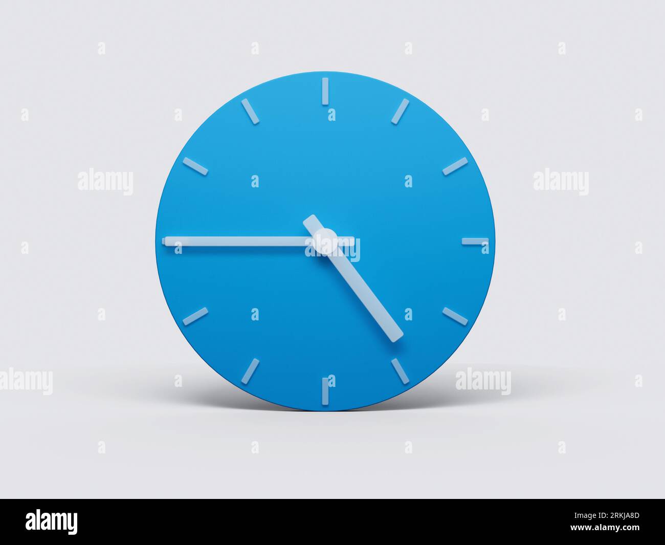 A white and blue analog clock sits on a wooden surface, its face ...