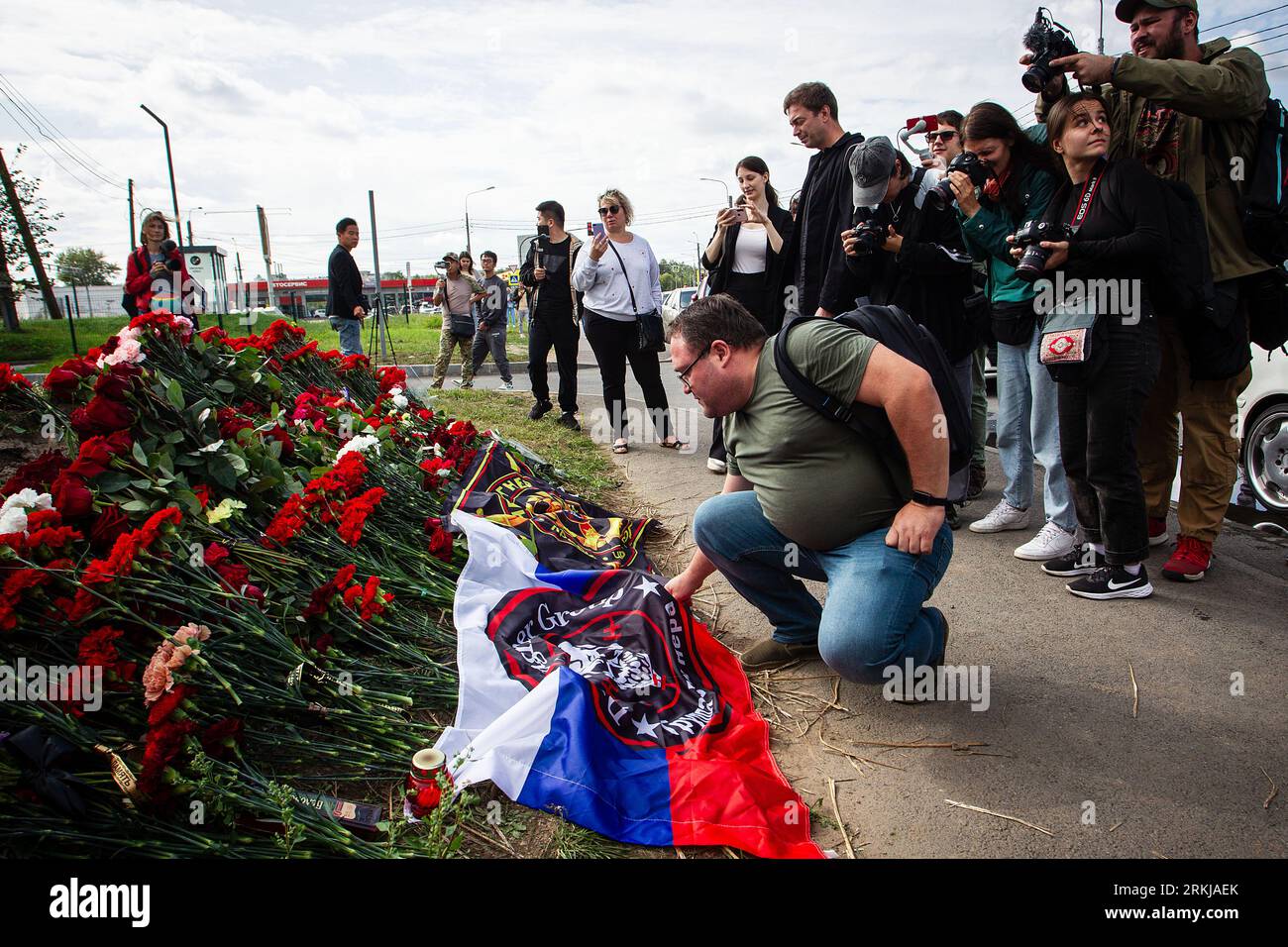 People lay flowers in memory of Yevgeny Prigozhin at a spontaneous ...