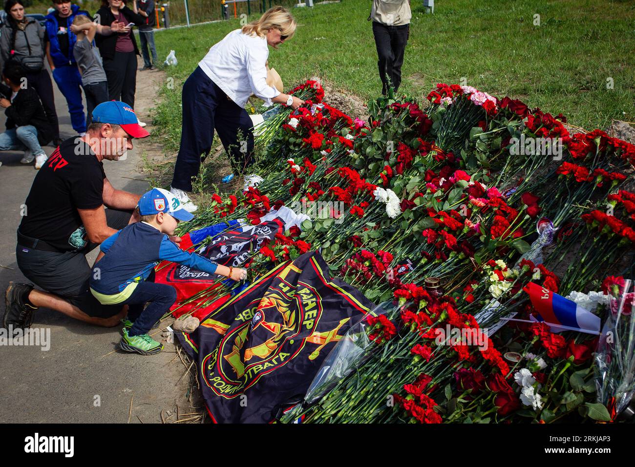 People lay flowers in memory of Yevgeny Prigozhin at a spontaneous ...