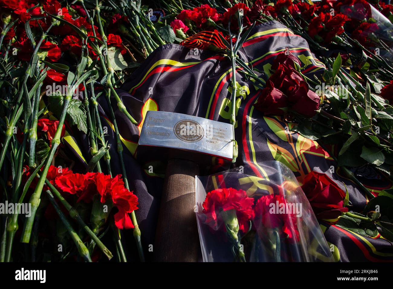 Laid flowers and a sledgehammer, one of the symbols of the PMC Wagner ...