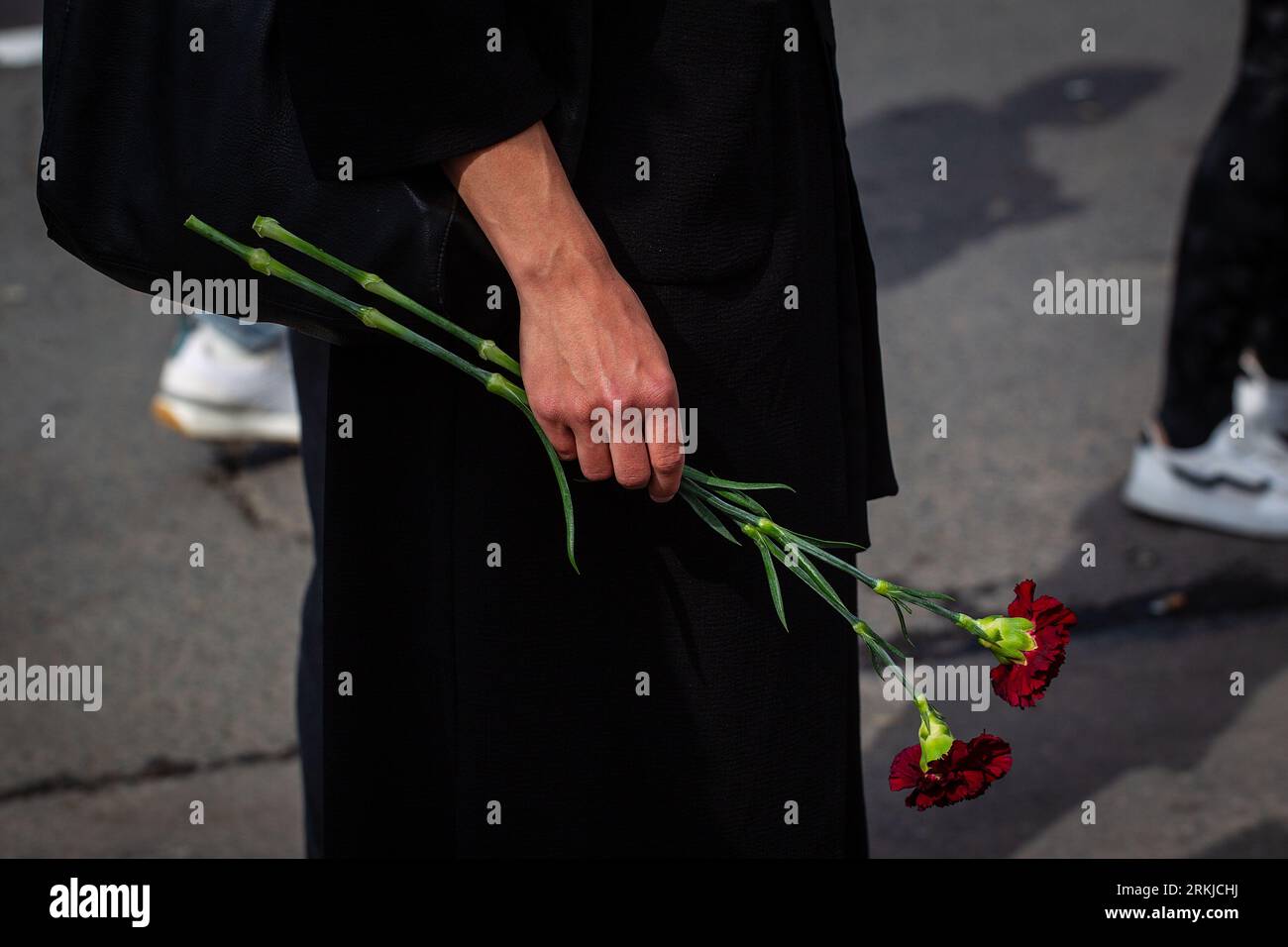 St. Petersburg, Russia. 24th Aug, 2023. A person holds flowers in ...