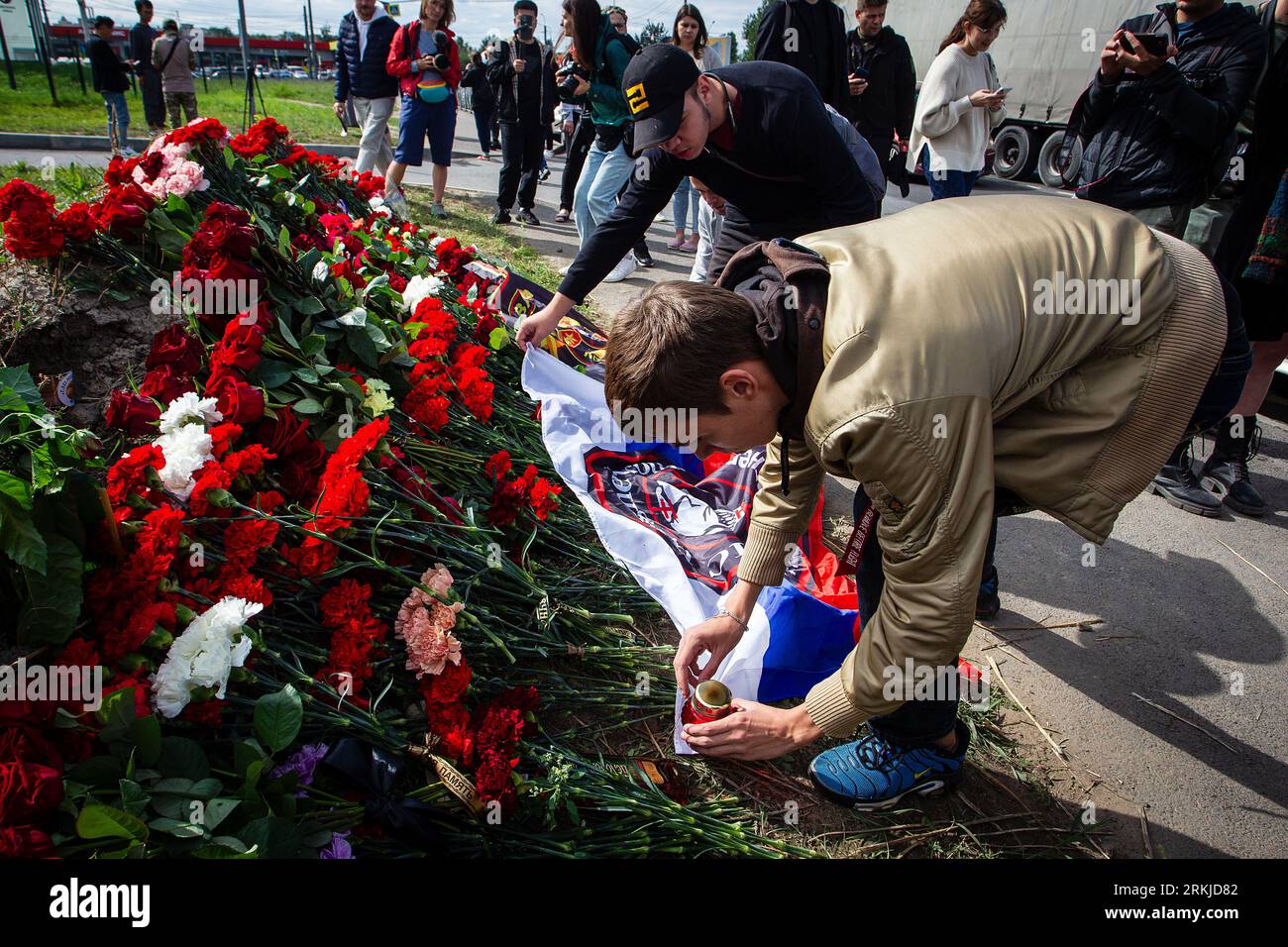 People lay flowers in memory of Yevgeny Prigozhin at a spontaneous ...
