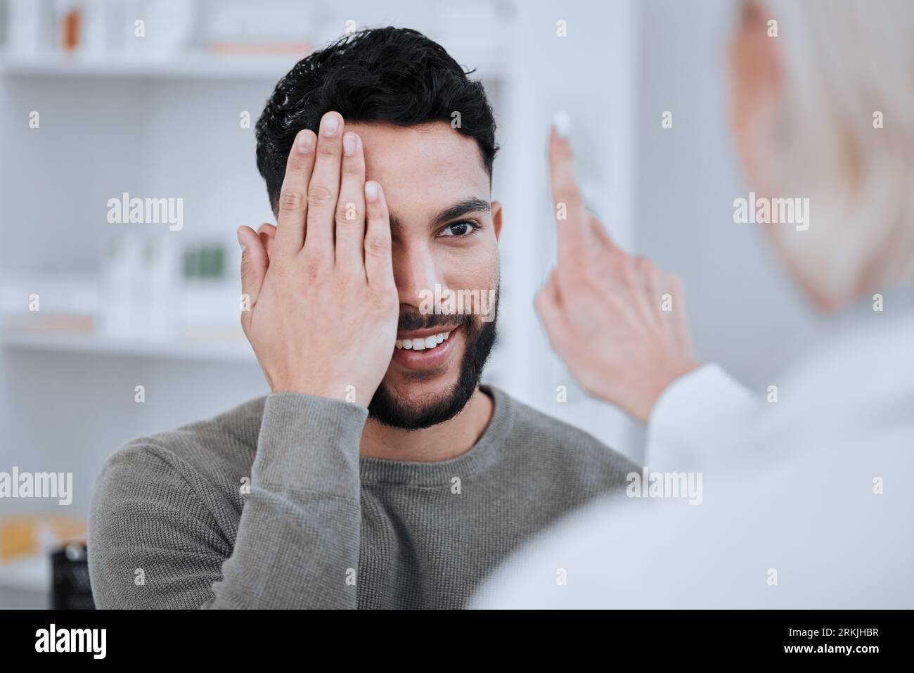 Hand on eye, test and vision, optometrist and patient with health and ...