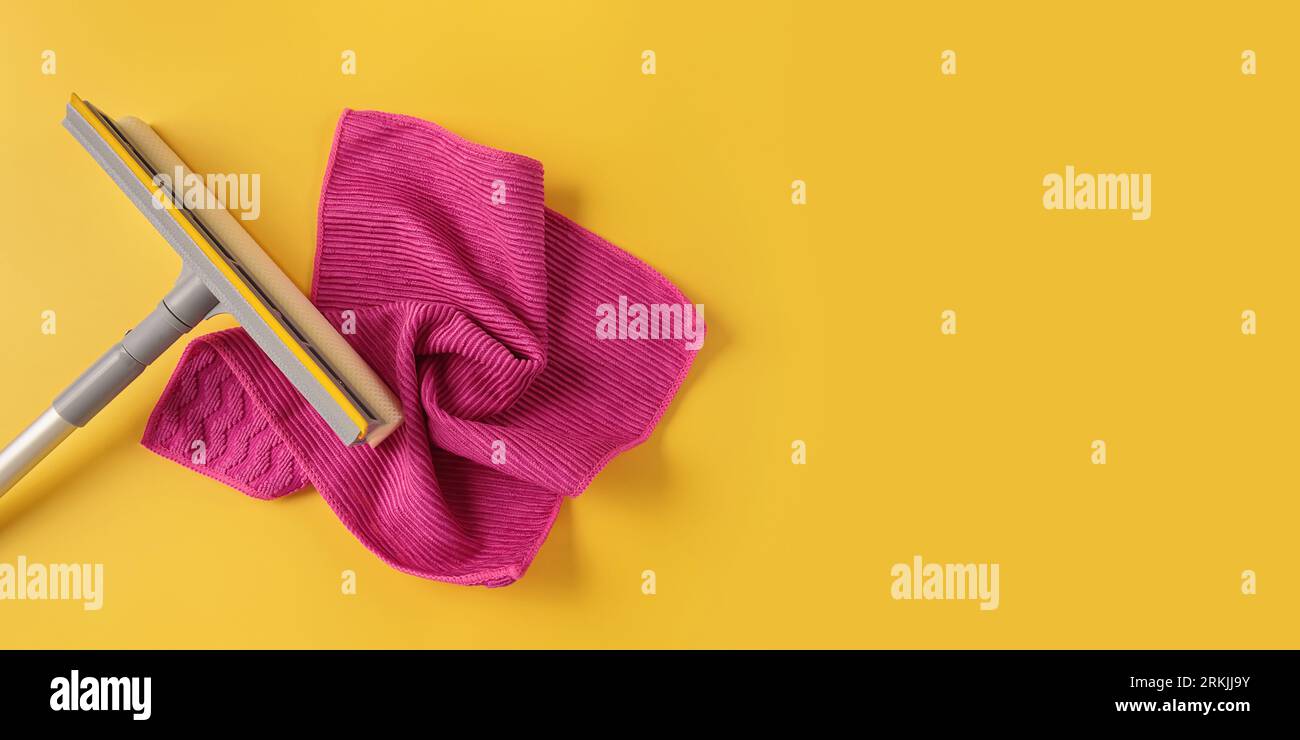 Set for cleaning windows and other surfaces on yellow background Stock ...