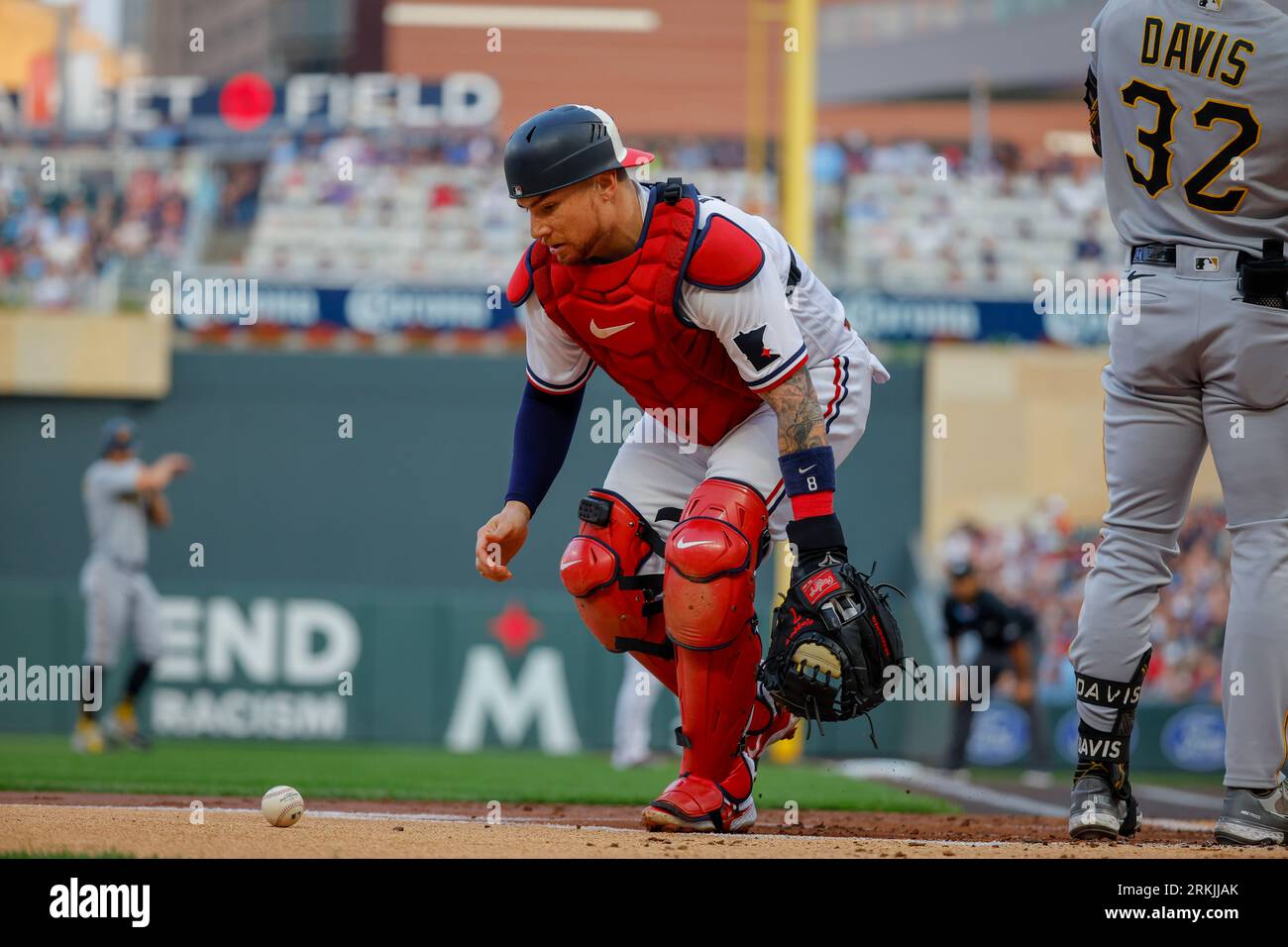 Minnesota Twins catcher Christian Vazquez picks up a loose ball as the ...