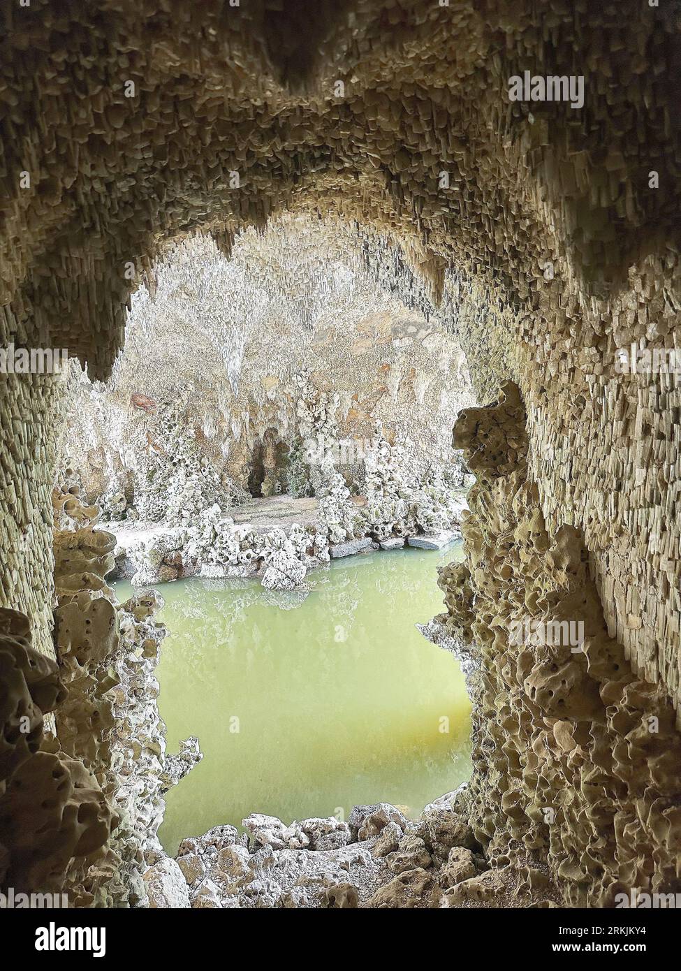 The expansive crystal grotto cave with a pool of shimmering turquoise ...