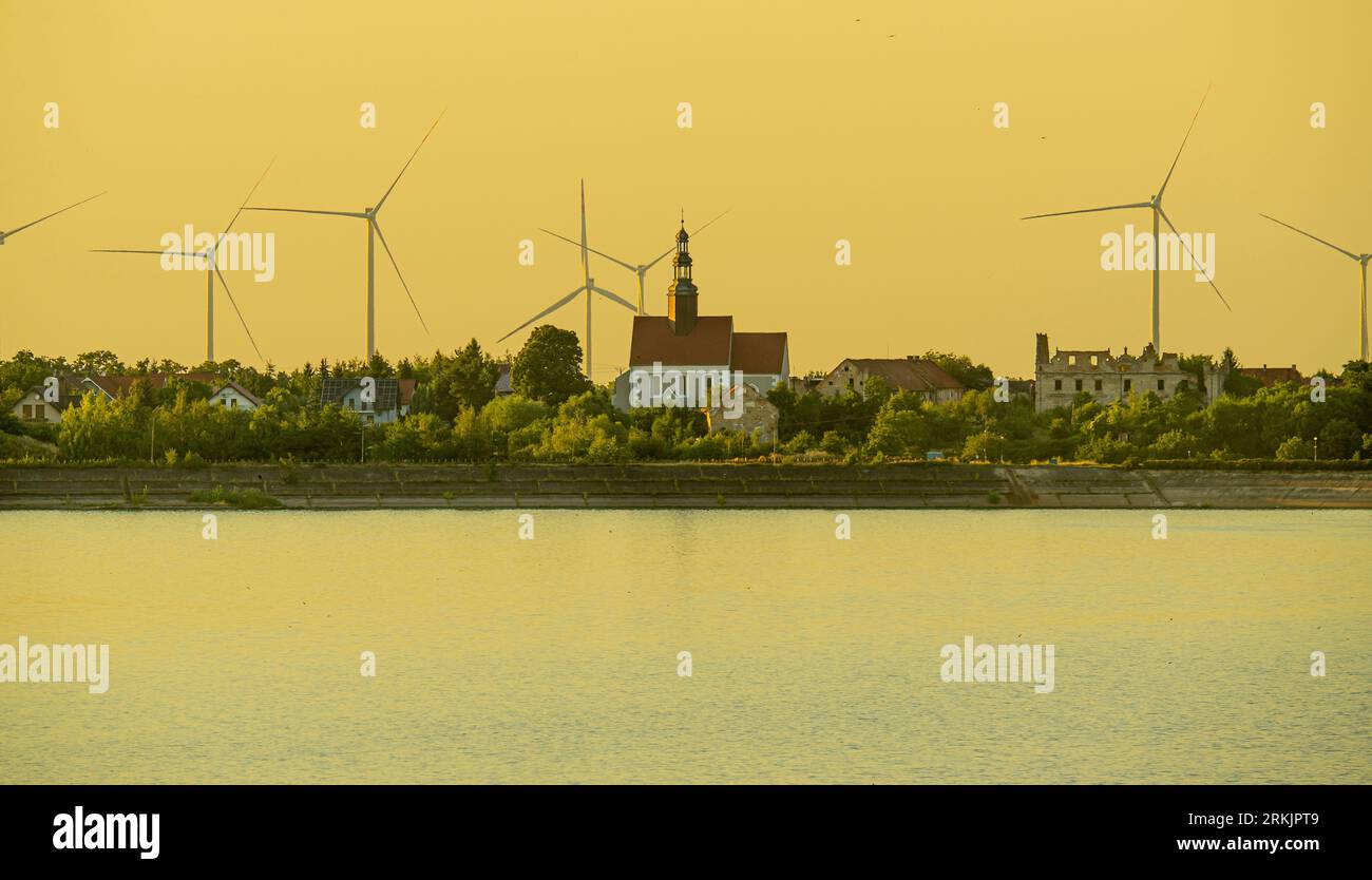 Wind farms by the lake - green energy Stock Photo - Alamy