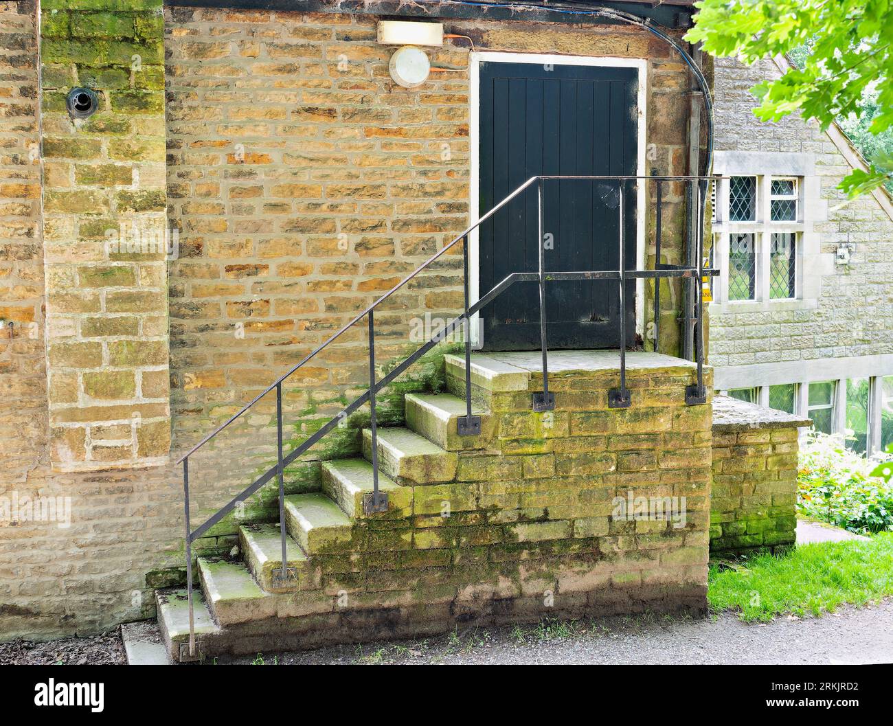 stone stair case on the outside of building leading to a wooden back ...