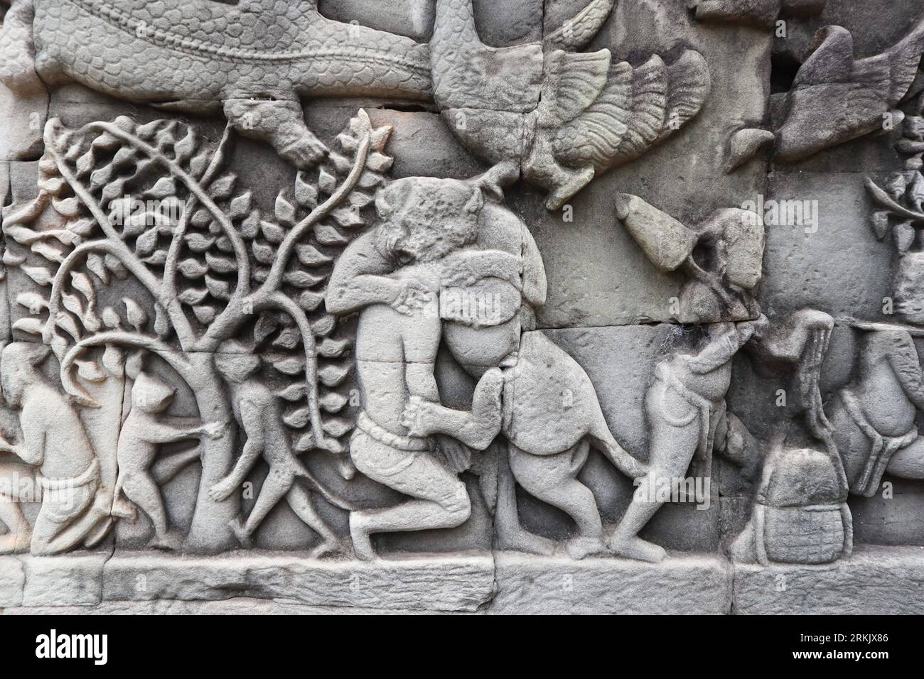 The bas-reliefs at the Bayon Temple in Cambodia depicting various ...