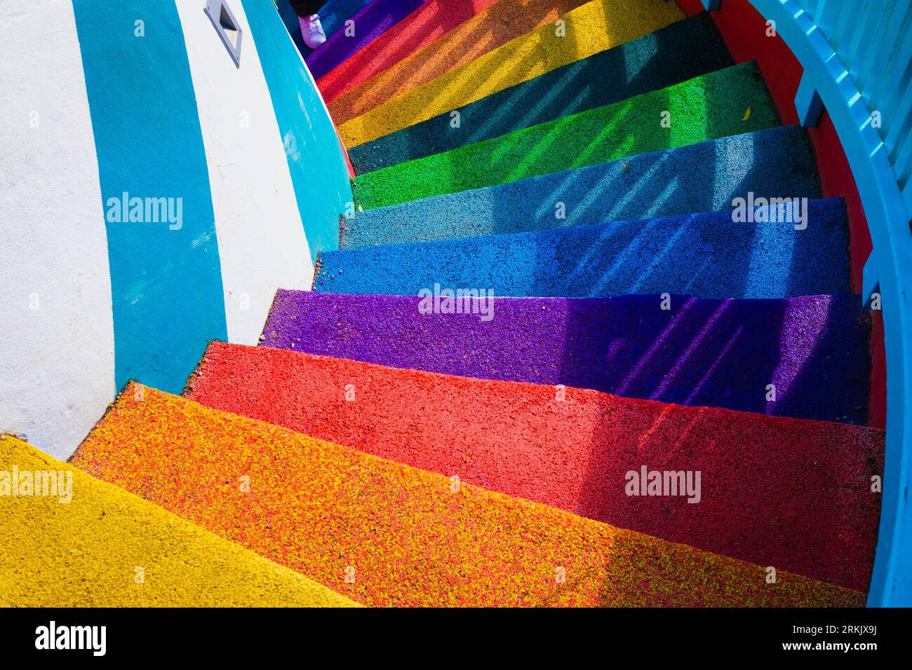 Rainbow-hued steps form a lively and vibrant staircase, adding a burst ...