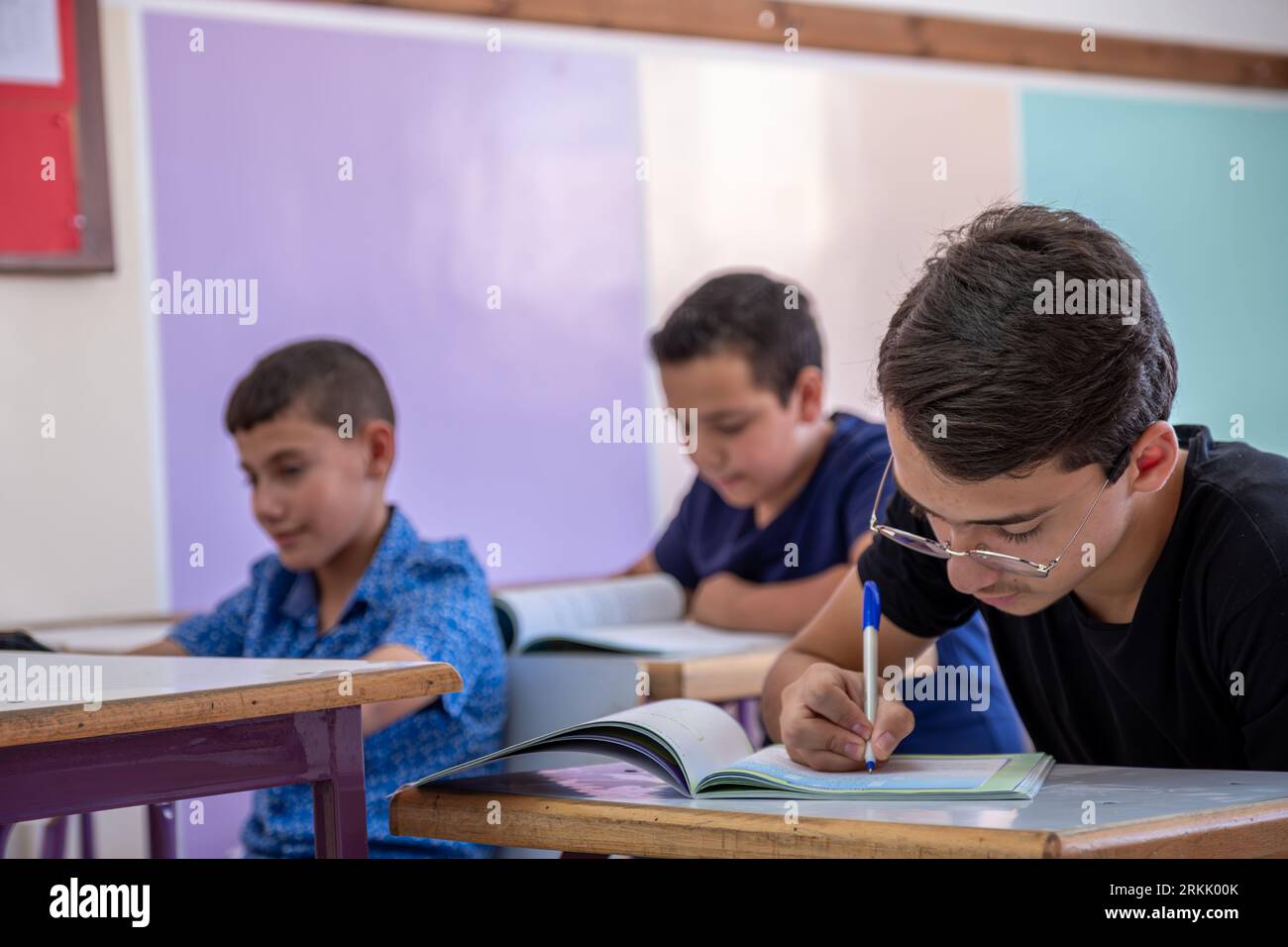 Students in class room doing exercise Stock Photo - Alamy
