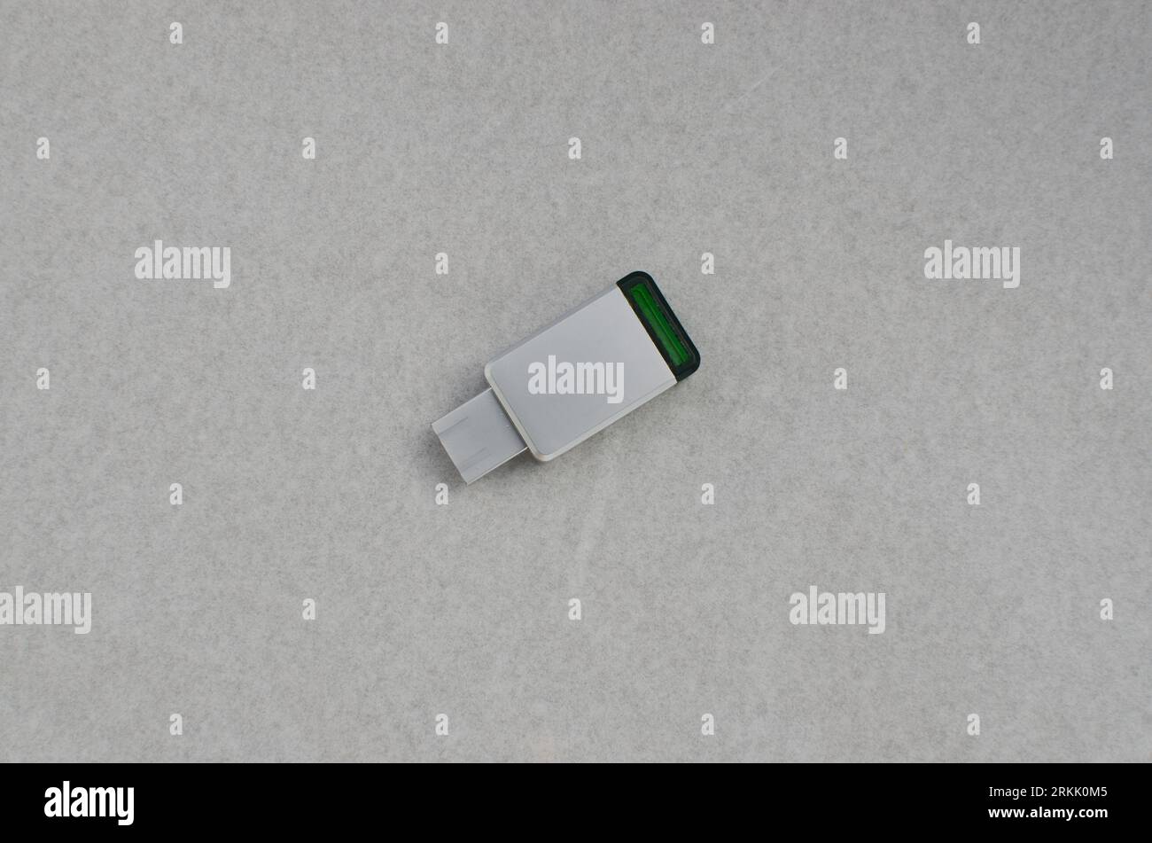 Aluminum flash drive close-up, modern and sturdy USB storage stick ...