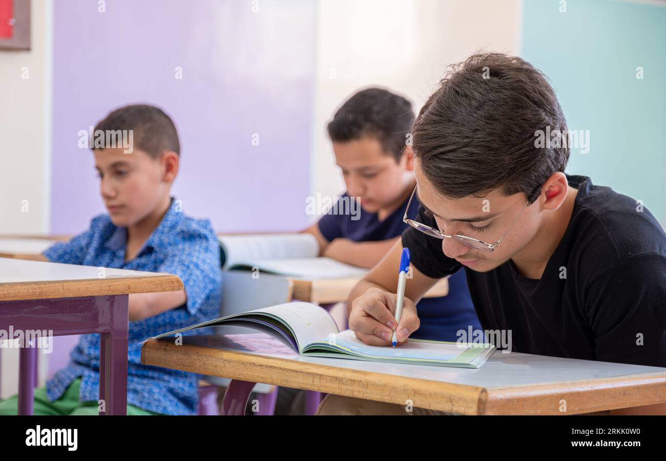 Students in class room doing exercise Stock Photo - Alamy