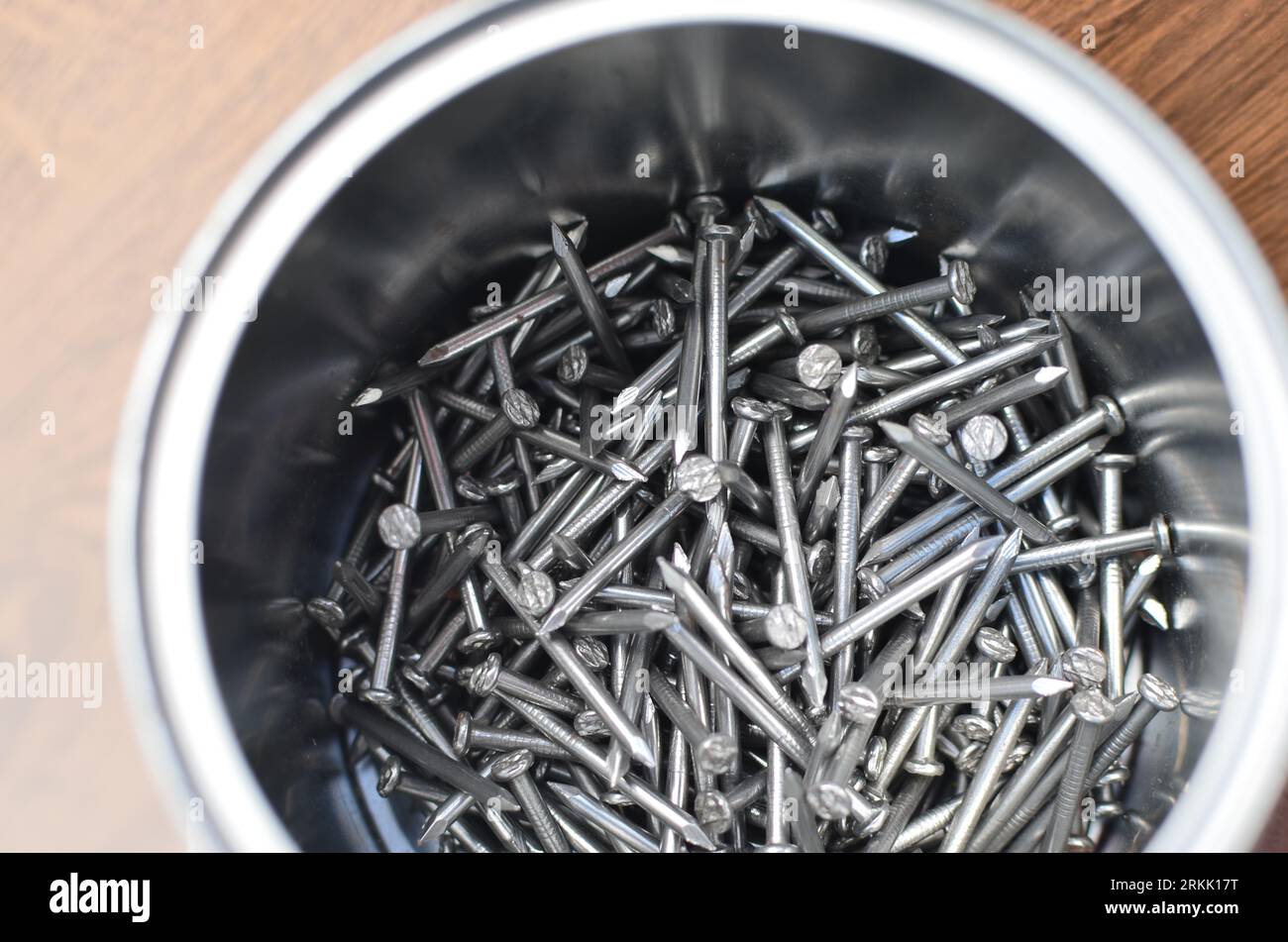 Detailed closeup of several steel nails, perfect for illustrating or ...
