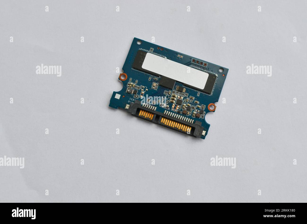 Detail of open SSD with exposed logic board for repair and data ...