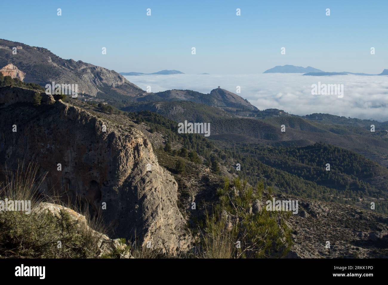 Morning with dense fog in the valley of Cocentaina, Spain Stock Photo ...