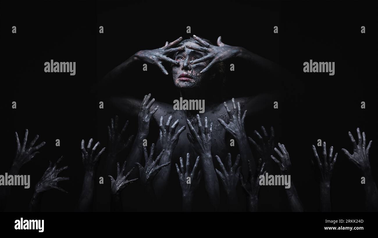 Halloween concept of fancy makeup of scary witch with demon hands ...