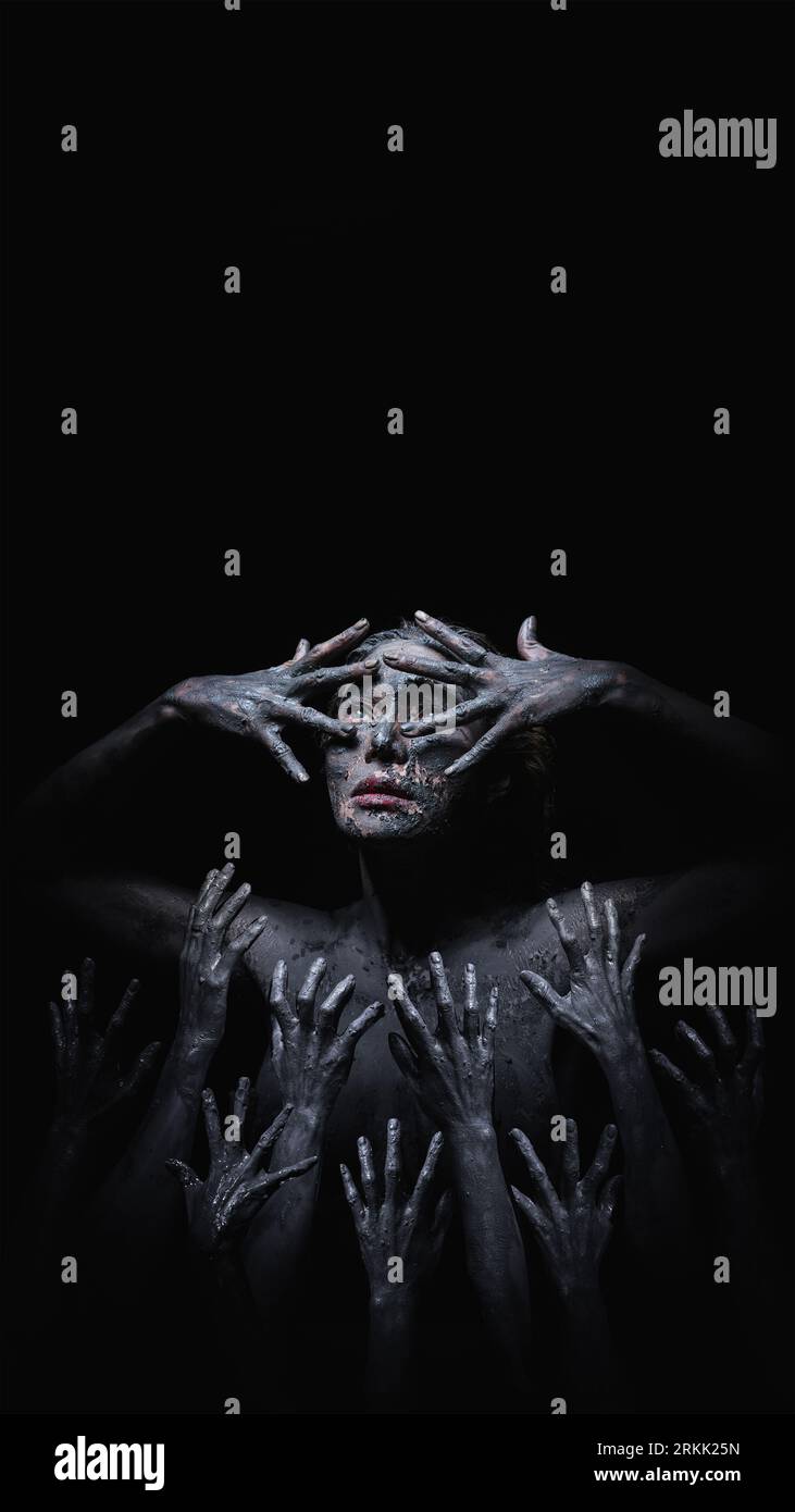 Halloween concept of fancy makeup of scary witch with demon hands ...