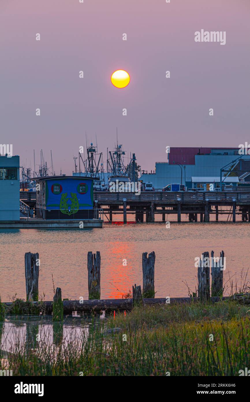 Sun shining through forest fire smoke in Steveston British Columbia ...