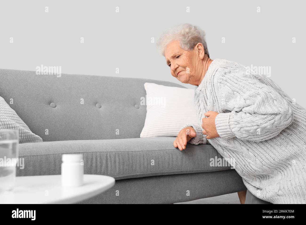 Heart attack aged female sitting hi-res stock photography and images ...