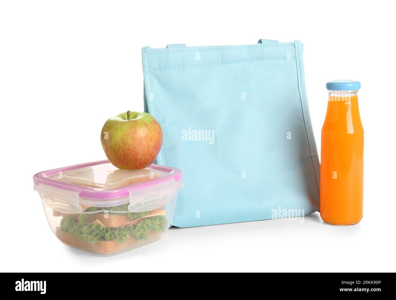 Lunch bag with lunchbox, apple and bottle of juice isolated on white ...