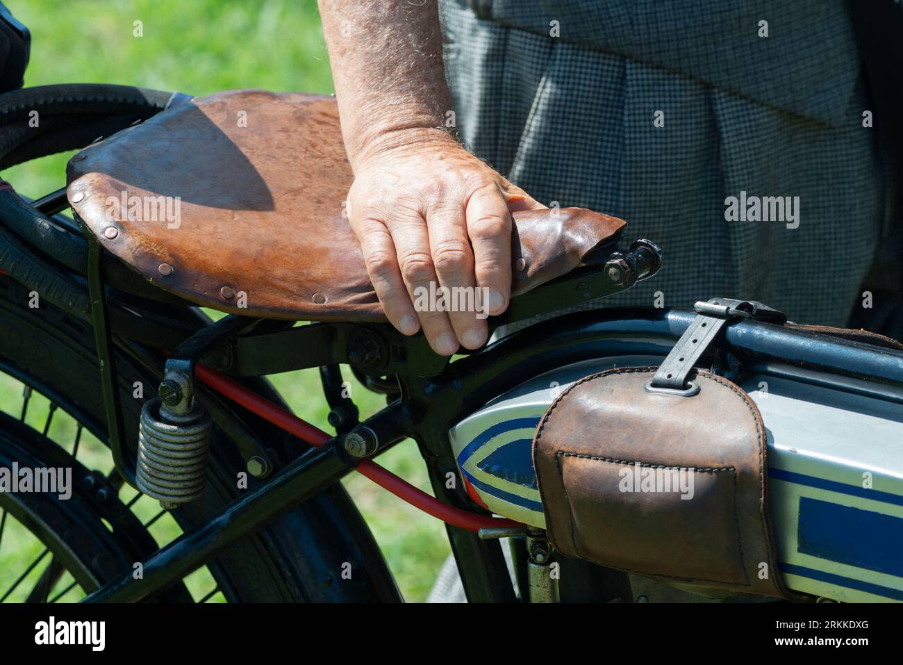 Man Hand Holding the Saddle of a Vintage Motorcycle Stock Photo - Alamy