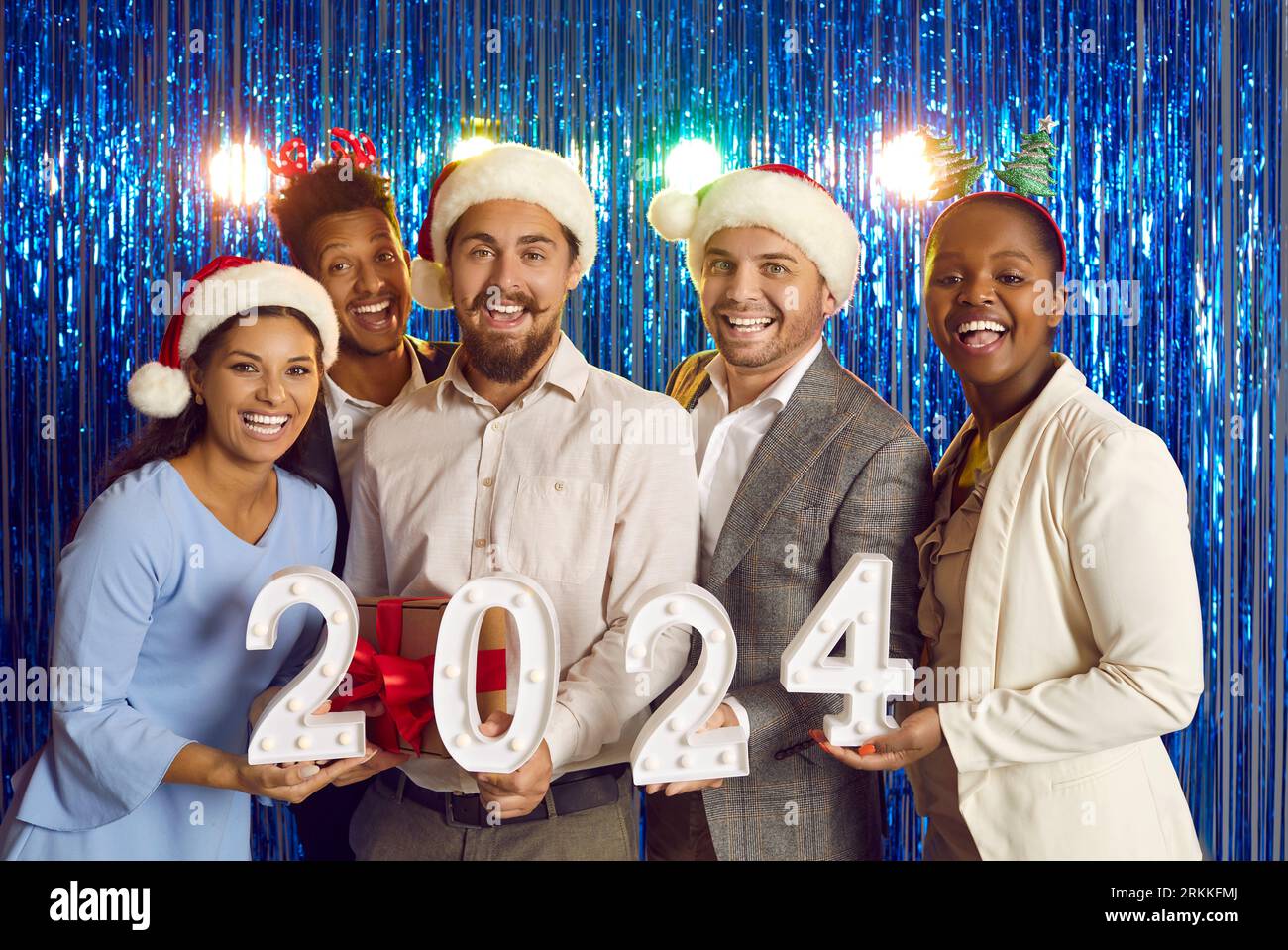 Portrait of happy young people holding numbers 2024 year Stock Photo ...