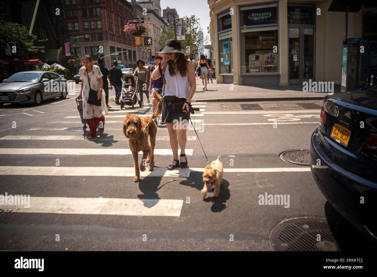 Street activity in the hot weather in Chelsea in New York on Wednesday ...