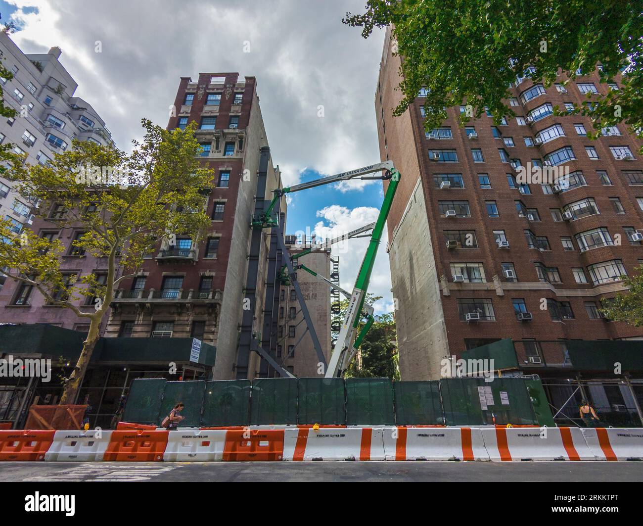 Bracing is installed on a building adjacent to a construction site on ...