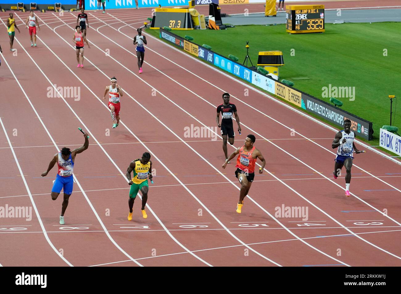 JT Smith, of the United States, left, finishes ahead of Rohan Watson ...