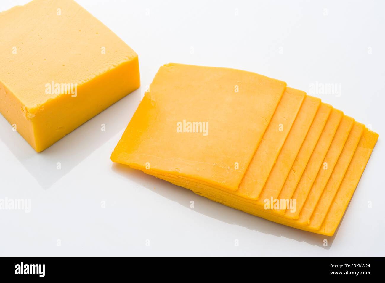 Cheddar cheese cut in slices Stock Photo - Alamy