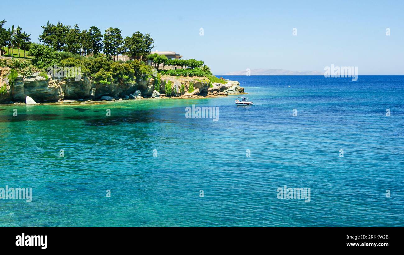 Greece blue lagoon and wreck Stock Photo - Alamy