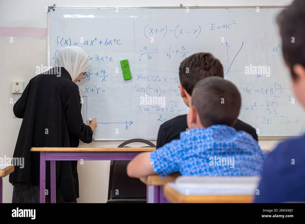 Children's in school so excited with their teacher and raising their ...