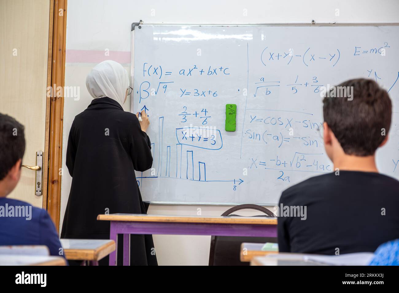 High school math raised hand hi-res stock photography and images - Alamy