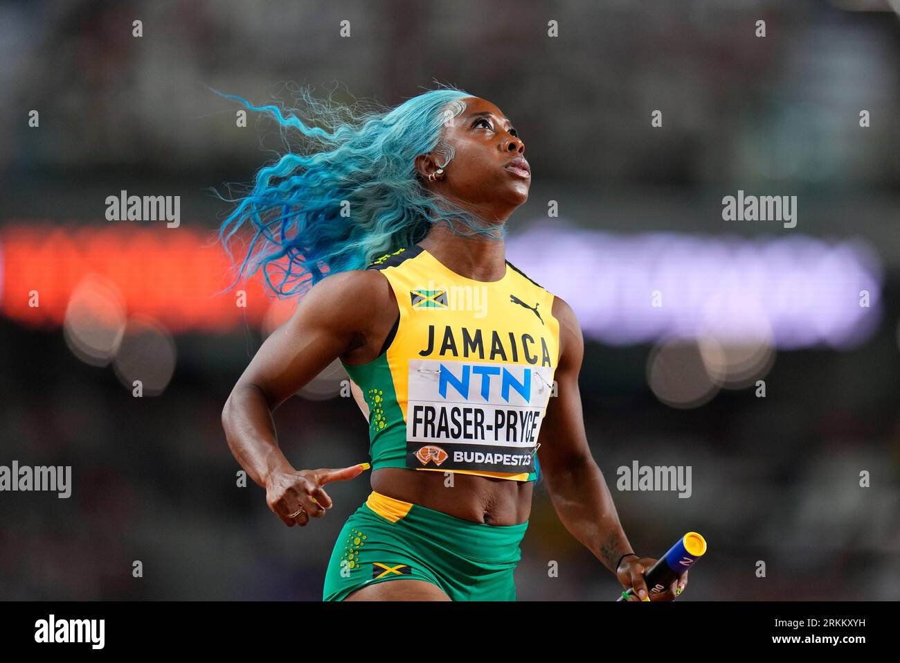 Shelly-Ann Fraser-Pryce, of Jamaica anchors her team to win a Women's 4x100-meters relay heat ...