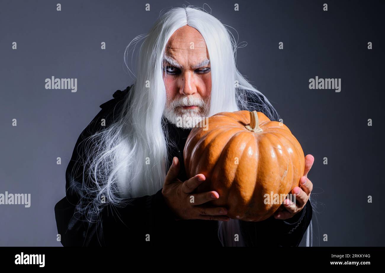 Devil vampire man with Halloween pumpkin. Horror. Male demon with Jack ...