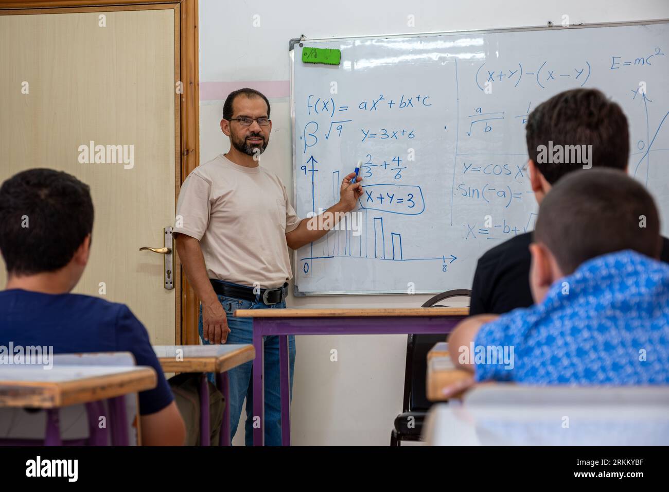 Children's in school so excited with their teacher and raising their ...