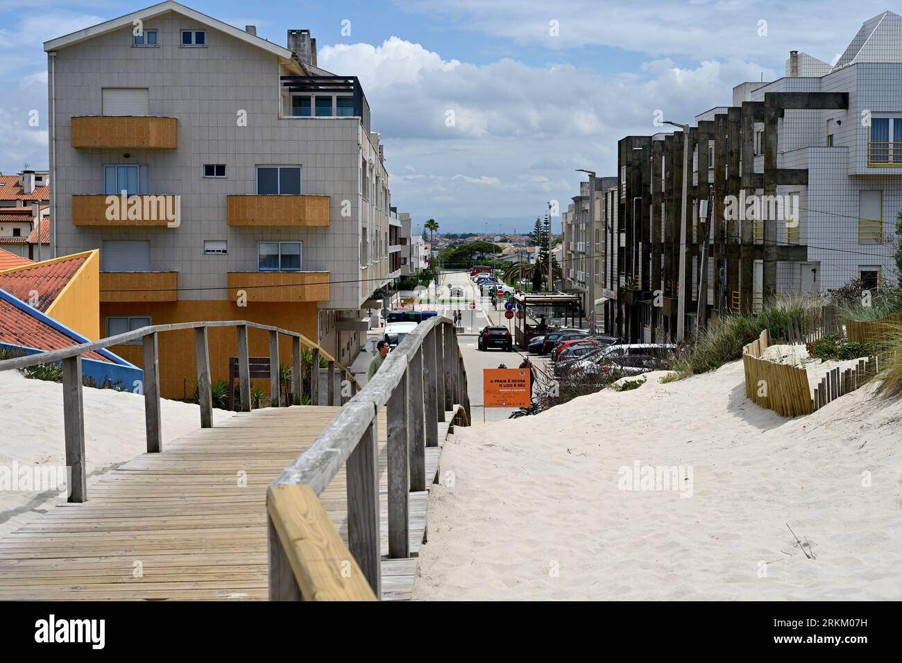 Looking from boardwalk of white sandy Praia da Barra beach to ...