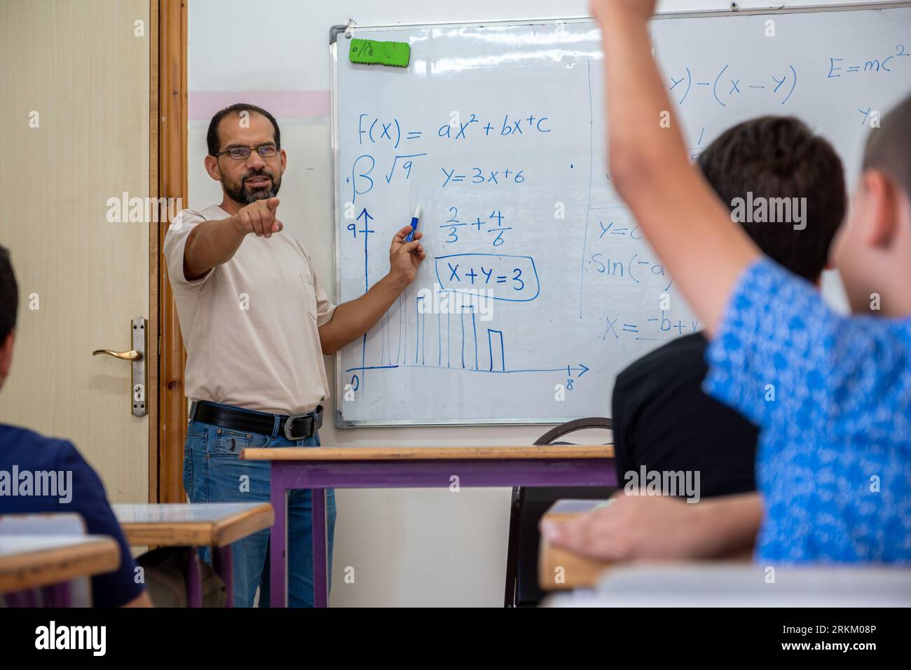 Children's in school so excited with their teacher and raising their ...