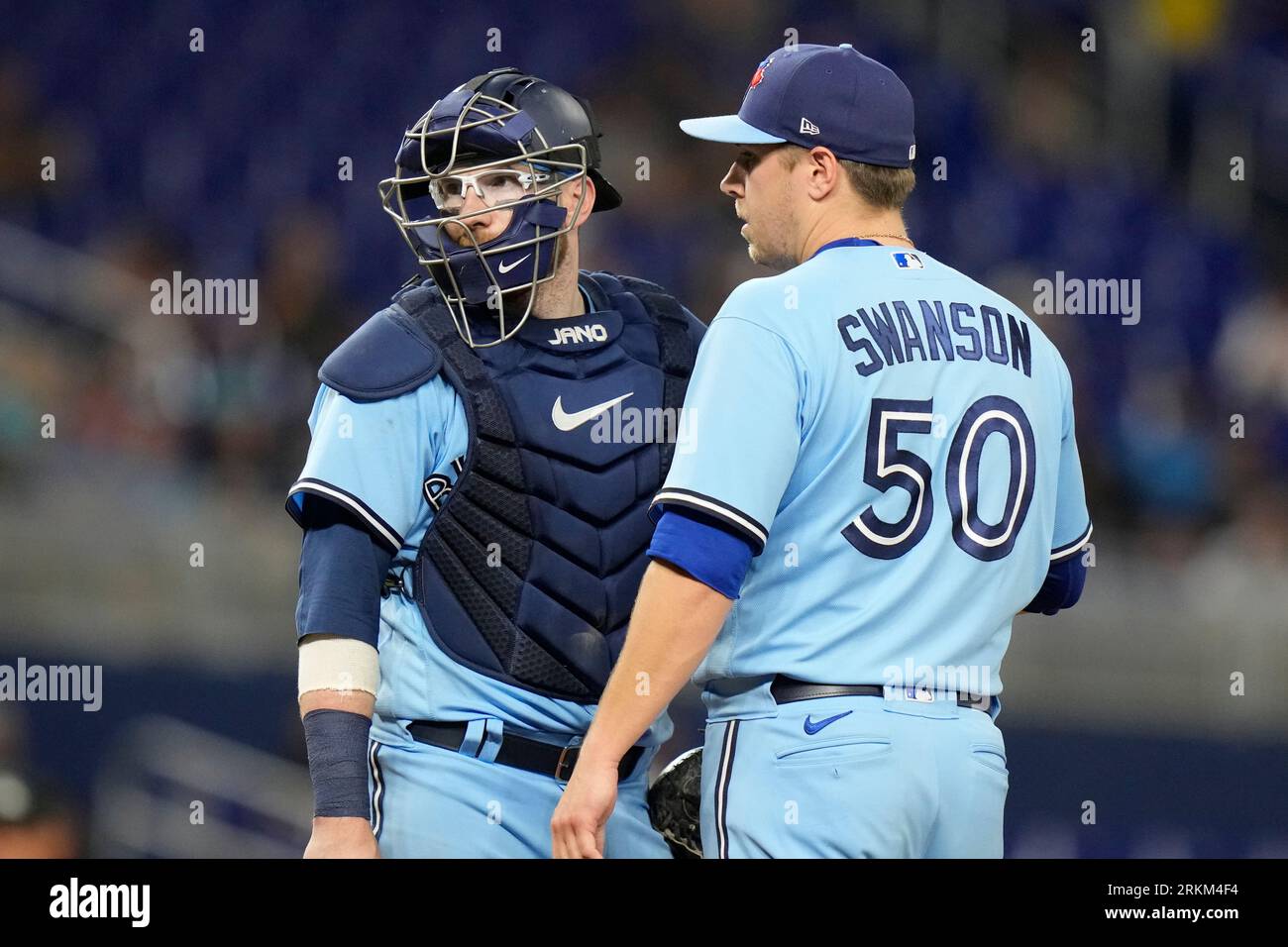 Toronto Blue Jays catcher Danny Jansen, left, talks with relief pitcher ...
