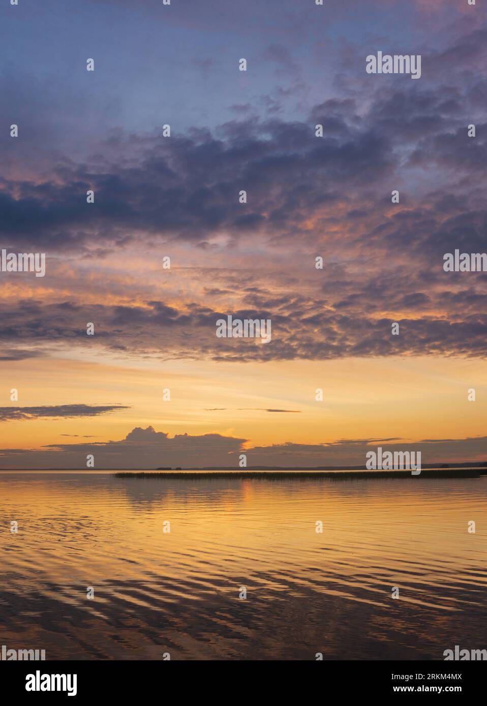 natural landscape with a beautiful sunset over the wide northern lake ...