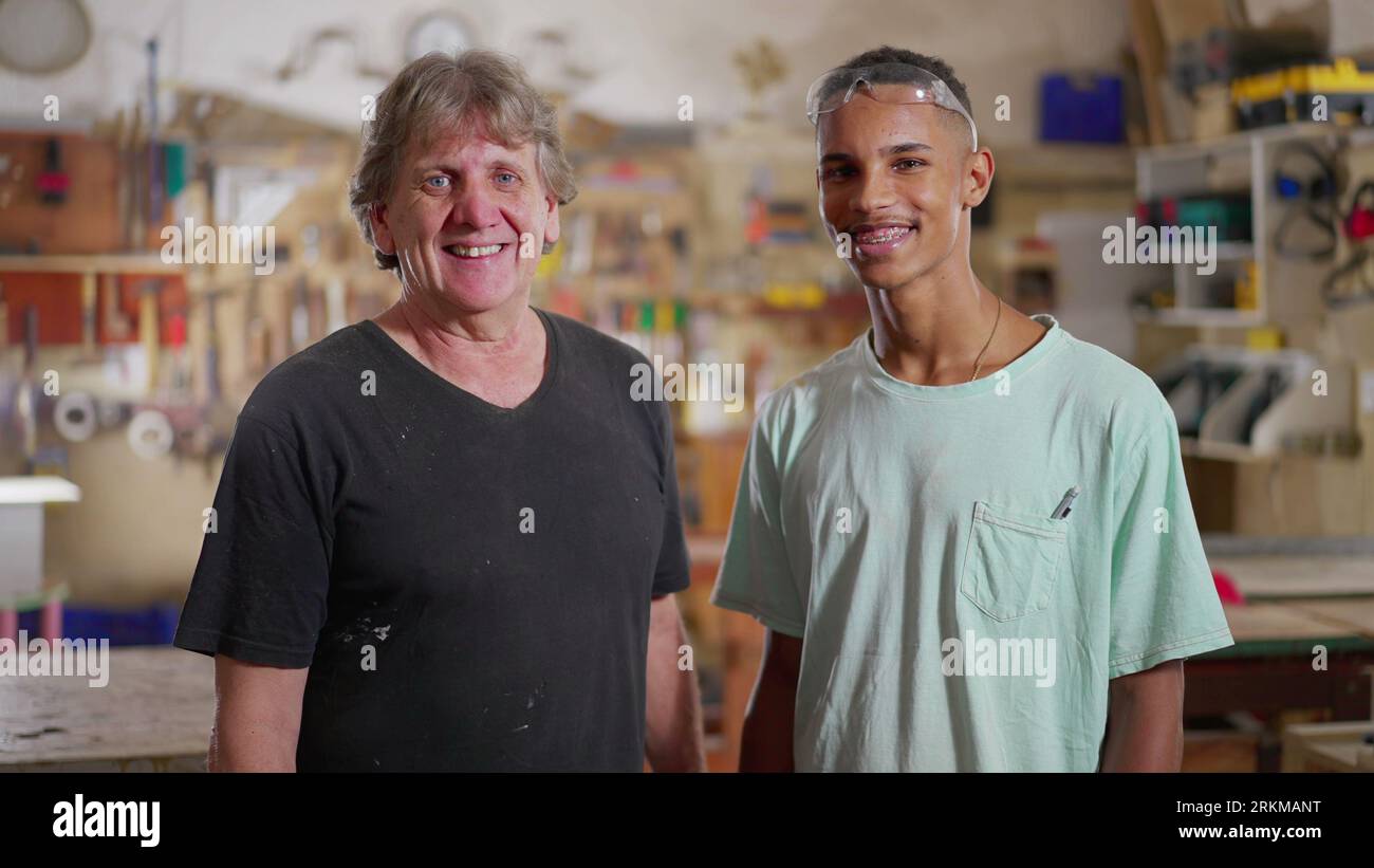 Friendly Carpenters of A Senior and an Apprentice Smiling in ...