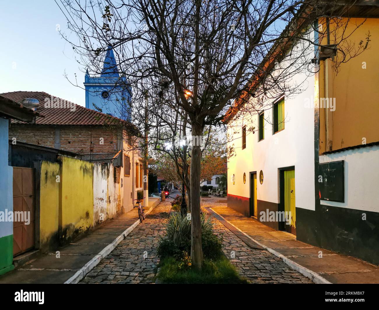 Empty village street with historic houses with lighted lamp posts at ...