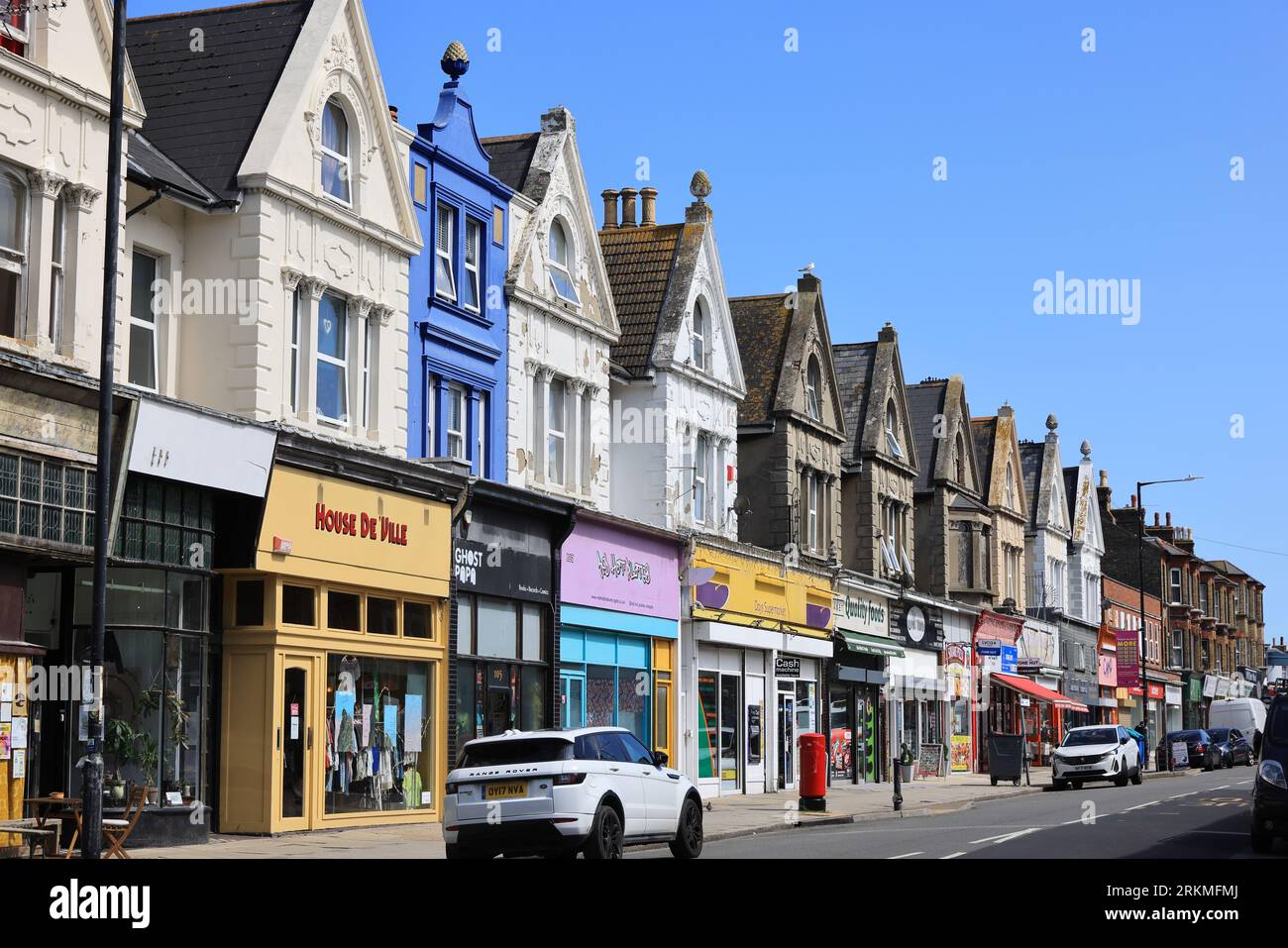 Colourful row of shops and properties on Northdown Road, in ...