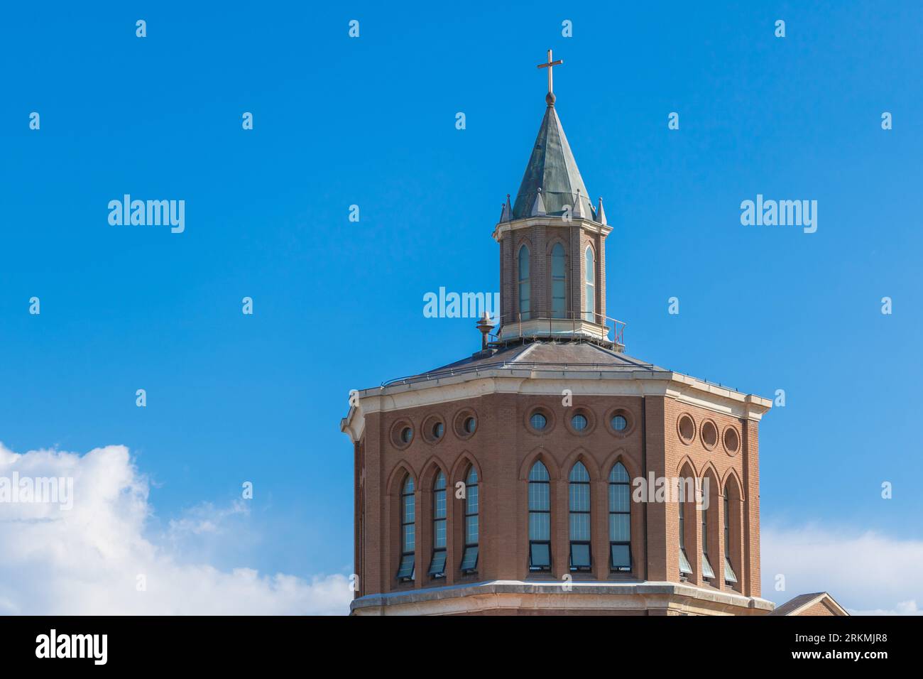 Church steeple against blue sky with white clouds in the city Stock ...
