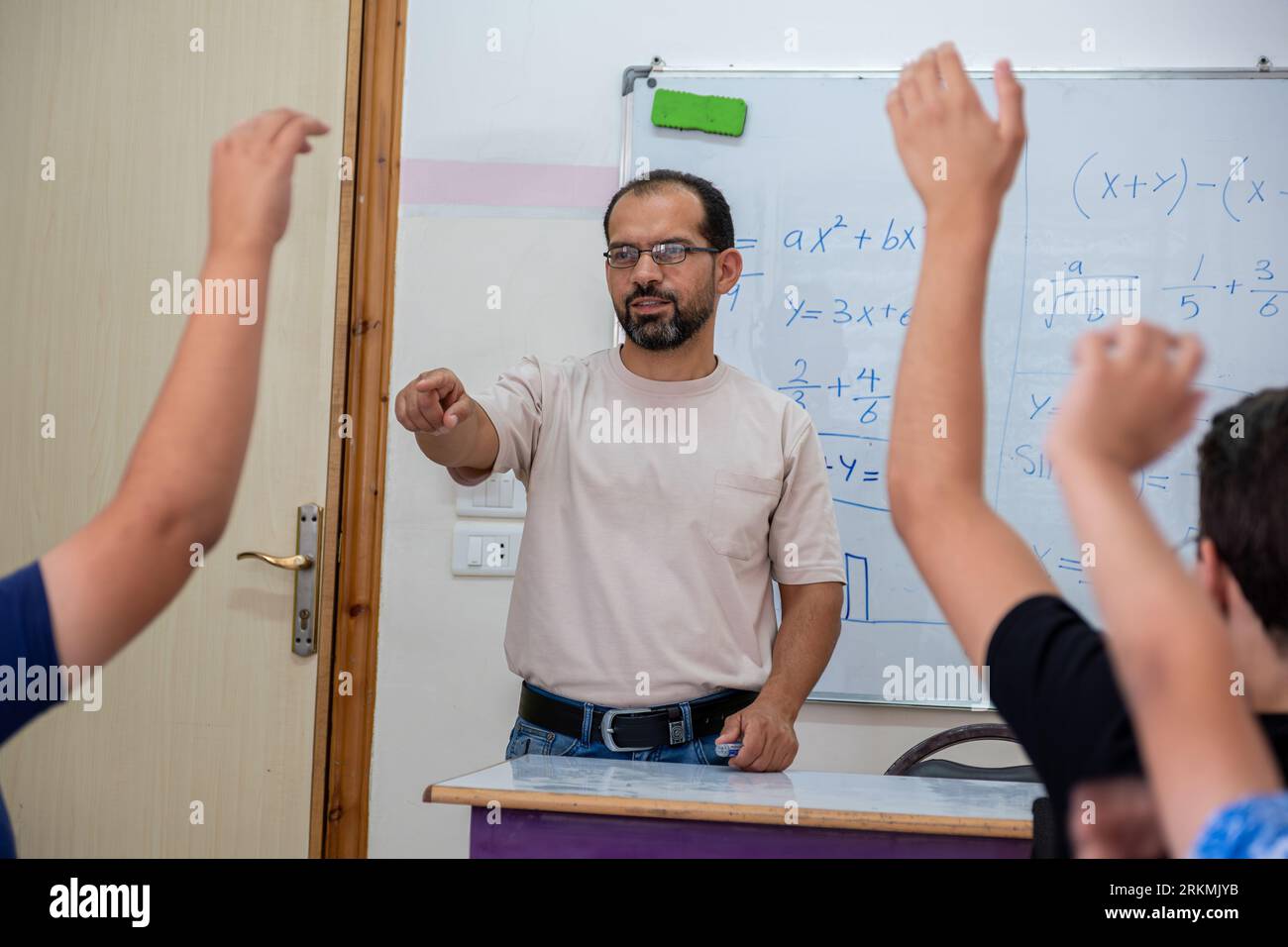 Children's in school so excited with their teacher and raising their ...