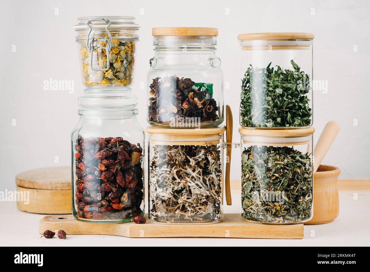 Dry medicinal herbal tea, various ingredients in jars Stock Photo - Alamy